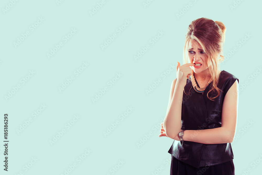 Neurotic. Closeup portrait nervous woman biting her fingernails craving ...