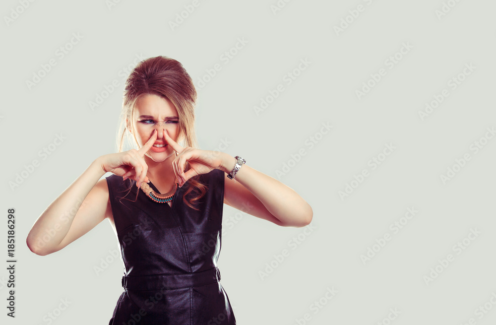 Stinky. Closeup portrait headshot woman pinches nose with fingers hands ... Stinky. Closeup portrait headshot woman pinches nose with fingers hands ...