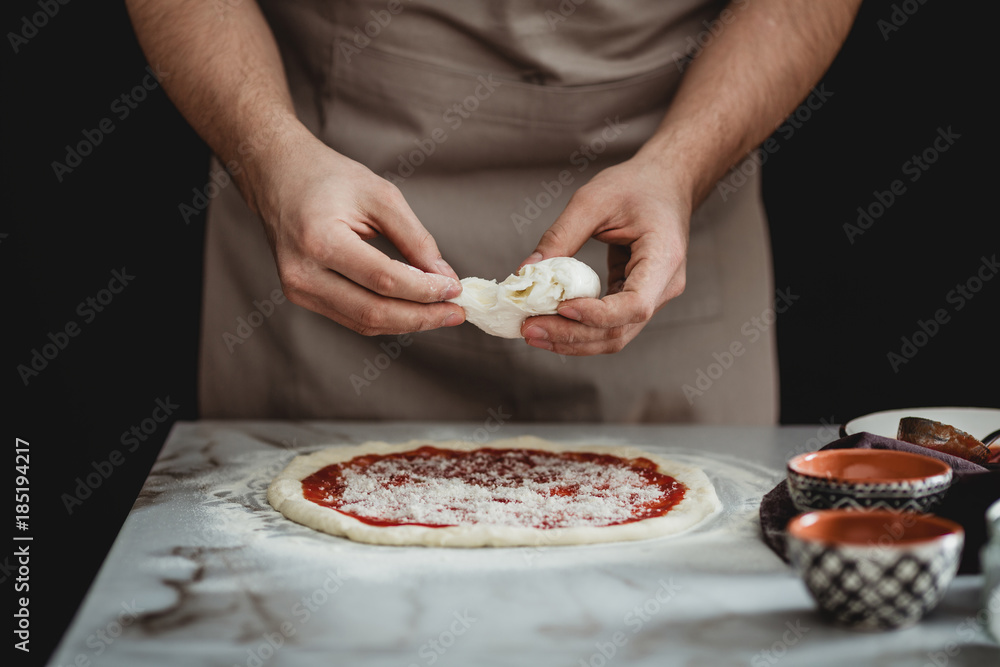 Man is making pizza Stock Photo | Adobe Stock