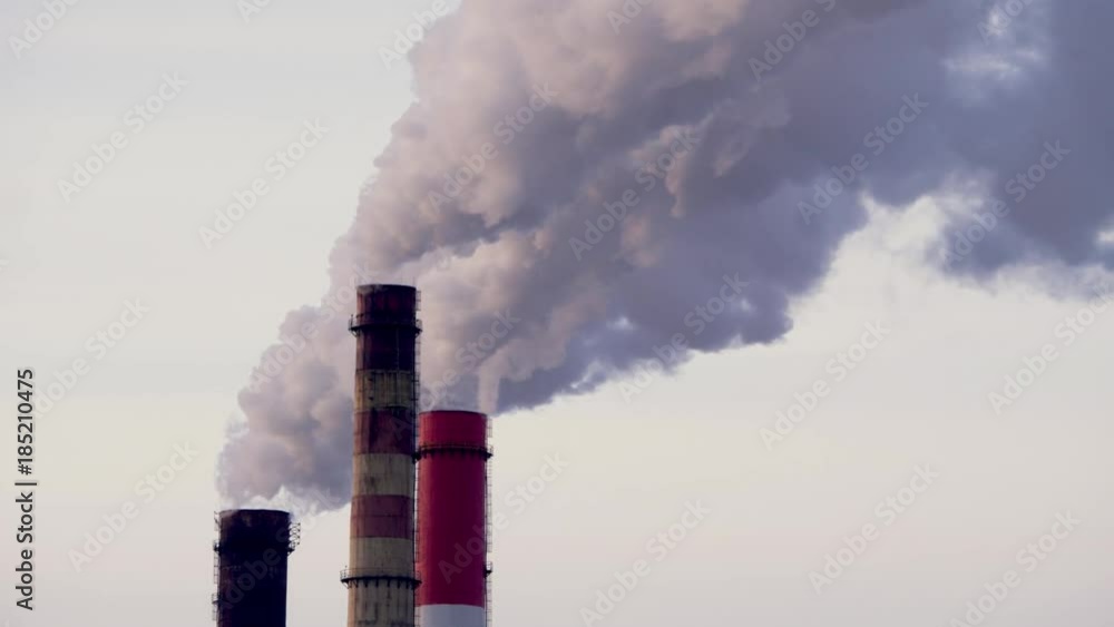 Pollution, smoke and steam discharged from a coal powered electrical ...