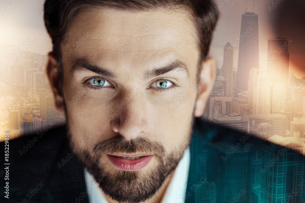 Stunning gaze. The portrait of a charming bristled man with beautiful ...