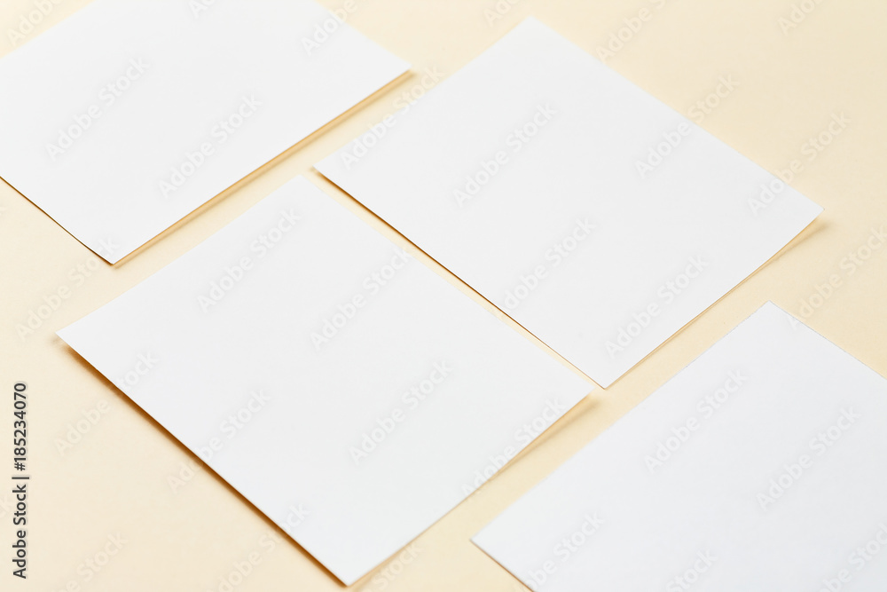 Blank white paper cards on a soft color background, business cards ...