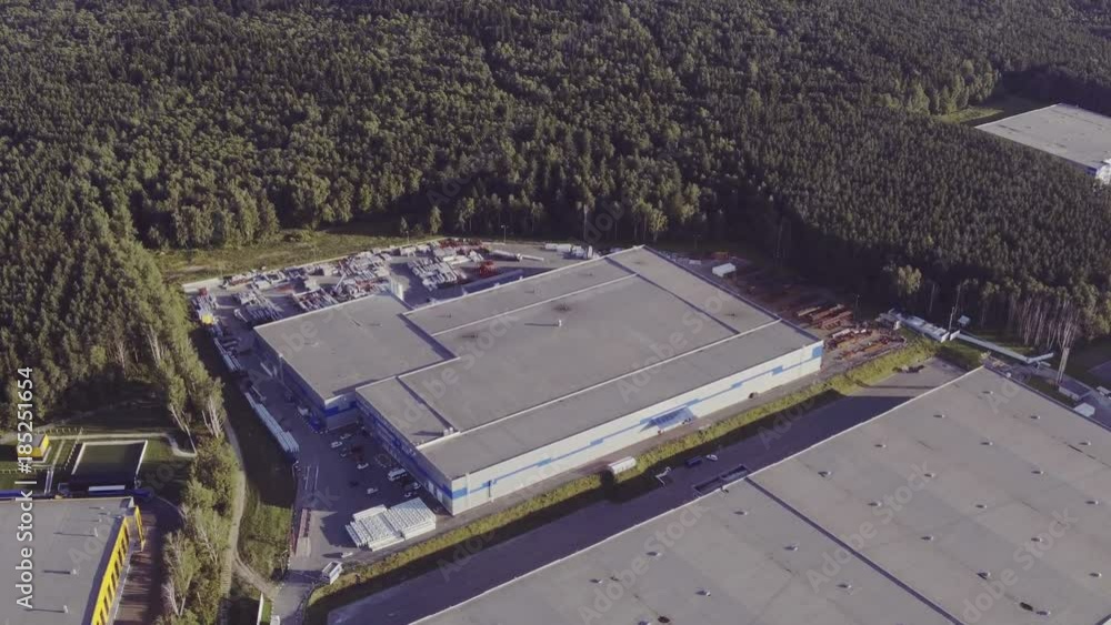 Aerial view of the logistics warehouse in forest Stock Video | Adobe Stock