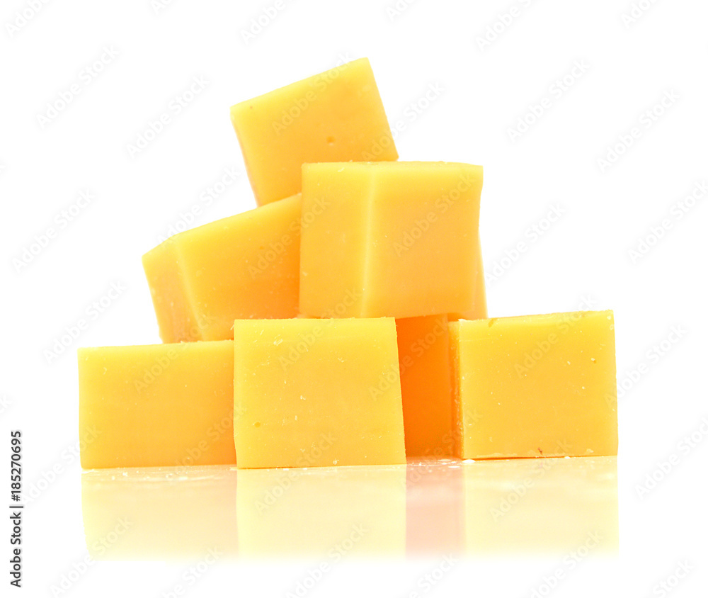 Cubes of cheddar cheese isolated on white Stock Photo | Adobe Stock
