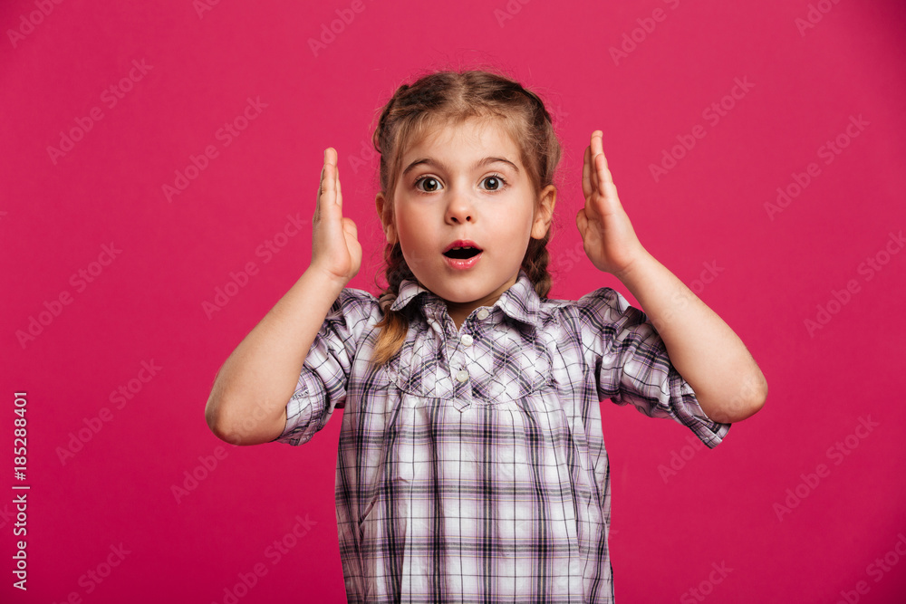 Shocked little girl child standing isolated Stock Photo | Adobe Stock
