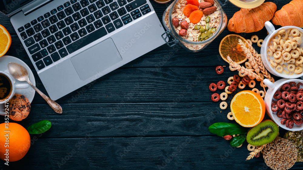 Business breakfast, muesli, coffee, milk, fruits, nuts and seeds, on a ...