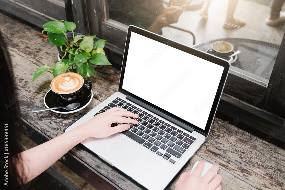 Mockup image of business woman using and typing on laptop with blank ...