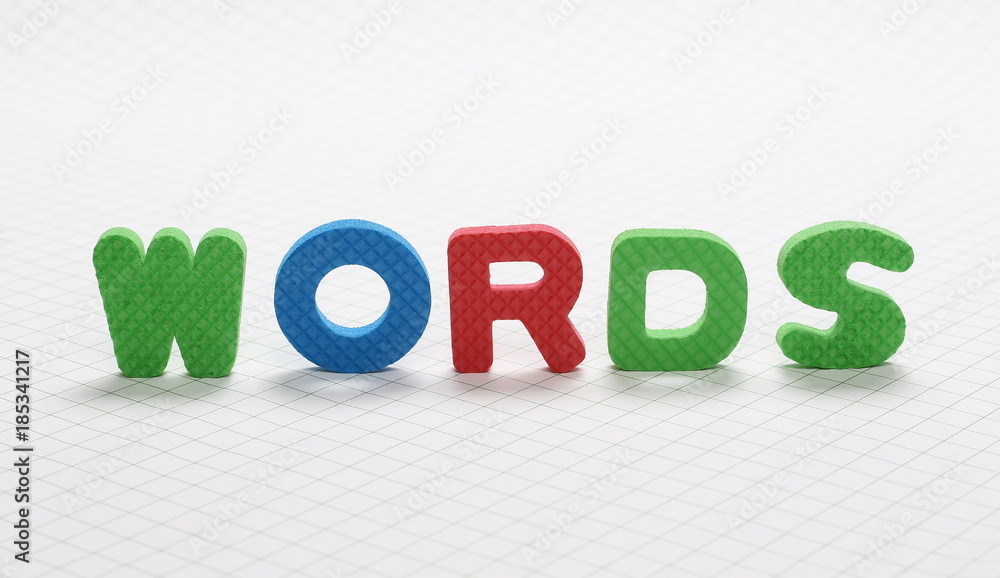 Alphabet letters spelling out words isolated on white checkered ...