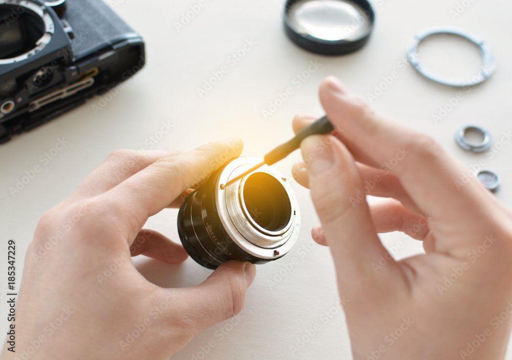 The engineer-technician checks the optics and carries out maintenance ...