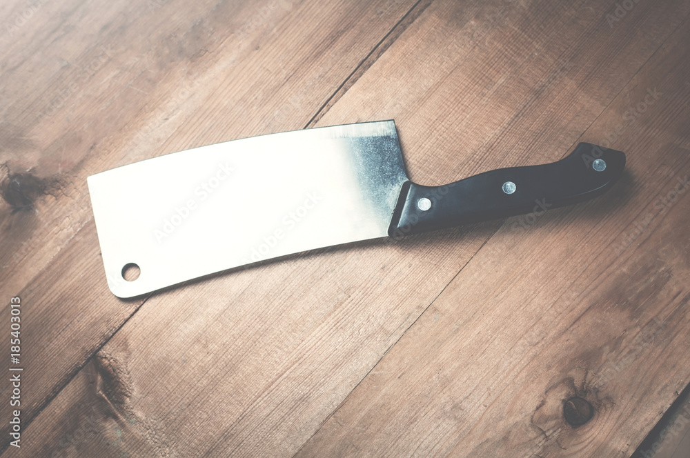 Kitchen knife on a wood background. Stock Photo | Adobe Stock
