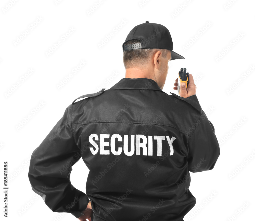Male security guard using portable radio on white background Stock ...