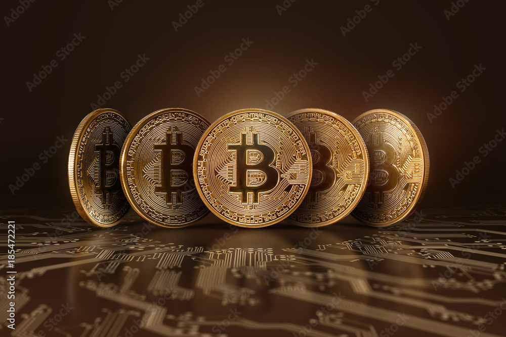 Five real Bitcoins coins on a dark background lined up on a digital ...