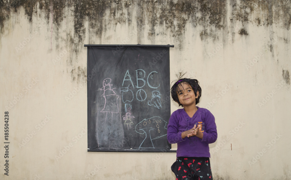 Indian child learning ABC alphabets by writing on a blackboard Stock ...