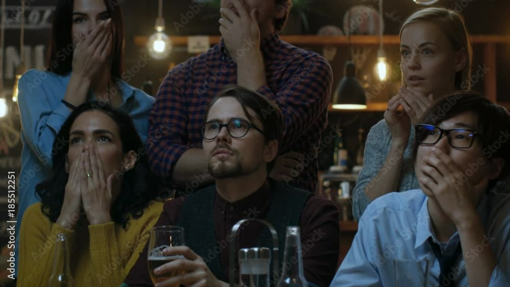 Young People in the Bar Watch TV Suddenly Breaking News Show that ...