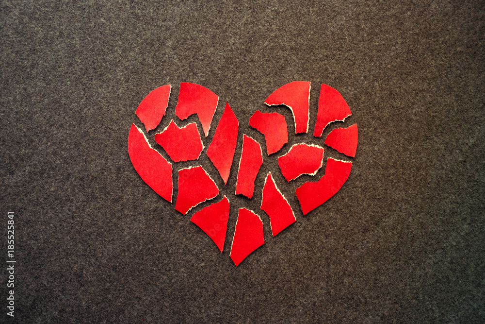 Paper red broken heart on dark felt background. Mosaic paper heart from ...