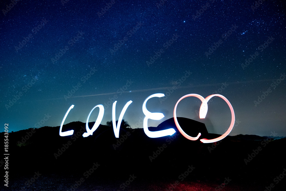 Love light paining alphabet over Stars in the night sky. Stock Photo ...