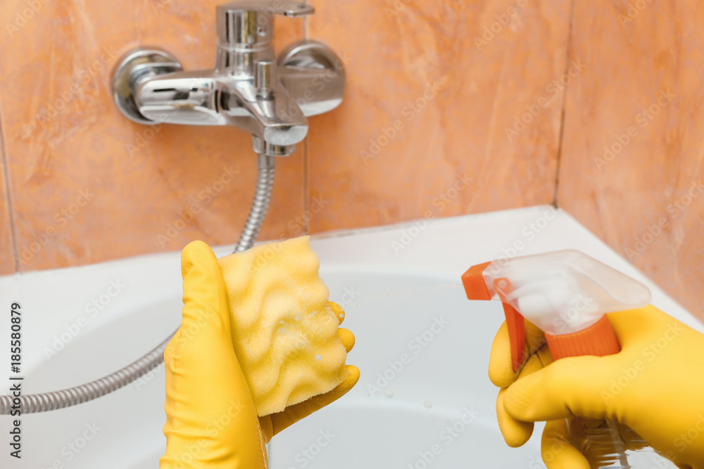Cleaner spray spray the mold on the sponge Stock Photo | Adobe Stock