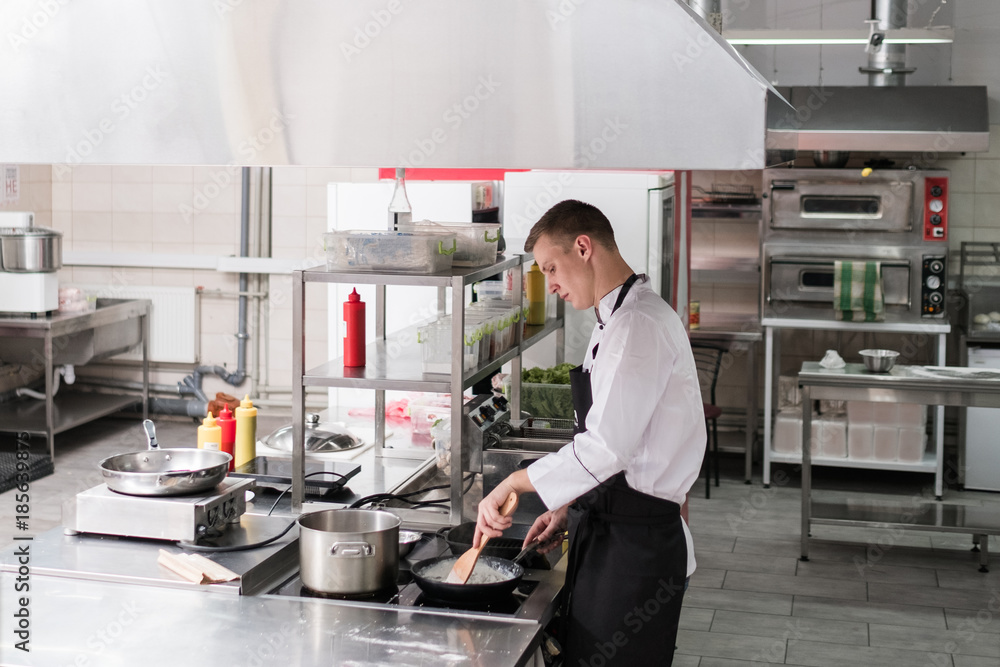 Restaurant kitchen interior. Workspace of talented and successful cooks ...