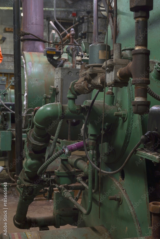 Old Boiler room in dirty old basement of warehouse building with rust ...
