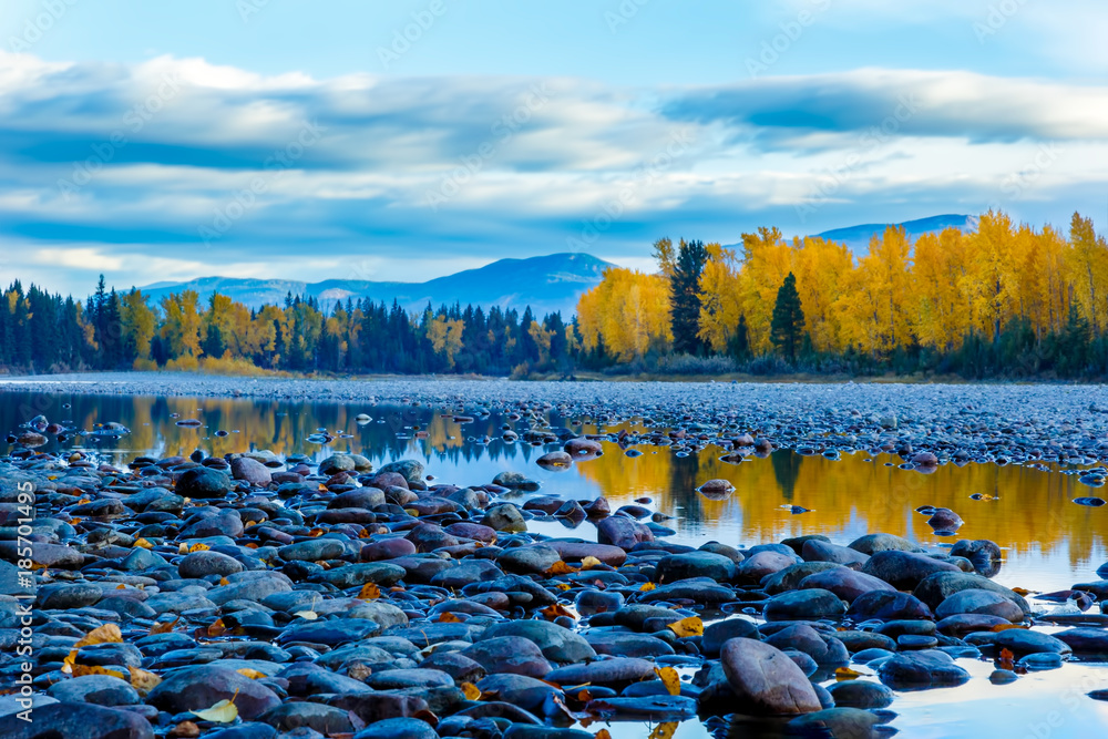 River rocks and color reflection on Flathead River, Montana in autumn ...