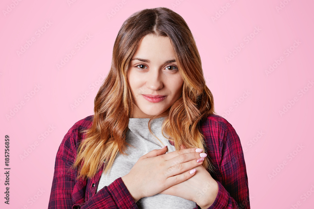 Body language concept. Gorgeous friendly looking young female in casual ...