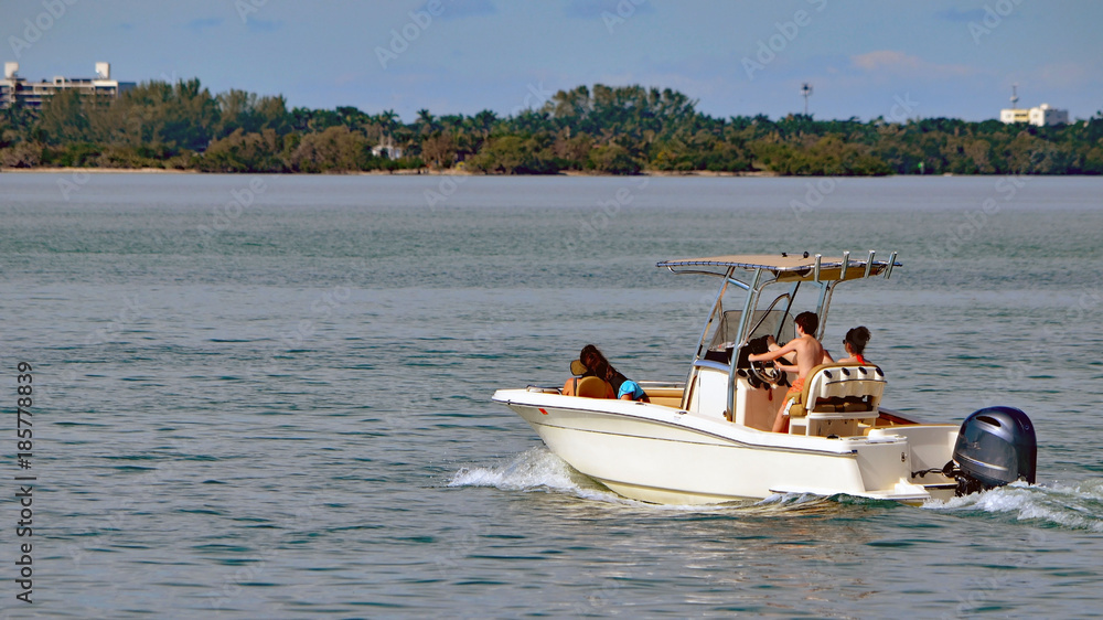 Family outing on the florida intra-coastal waterway in a small sport ...
