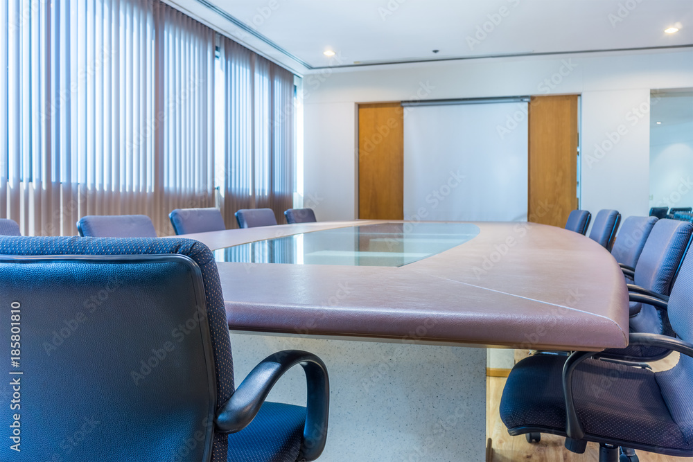 Meeting and conference room with projection screen in an office. There ...