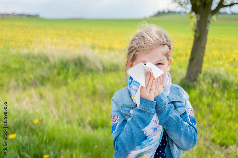 Allergy attack, girl blowing her nose suffering from pollen allergy ...