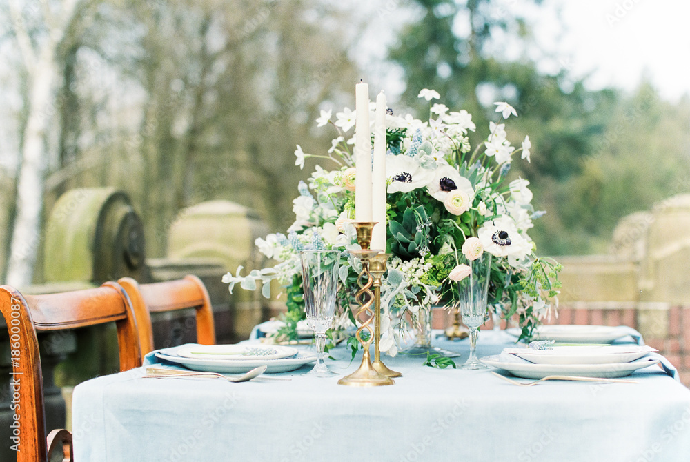 Pastel blue and gold outdoor dining table Stock Photo | Adobe Stock