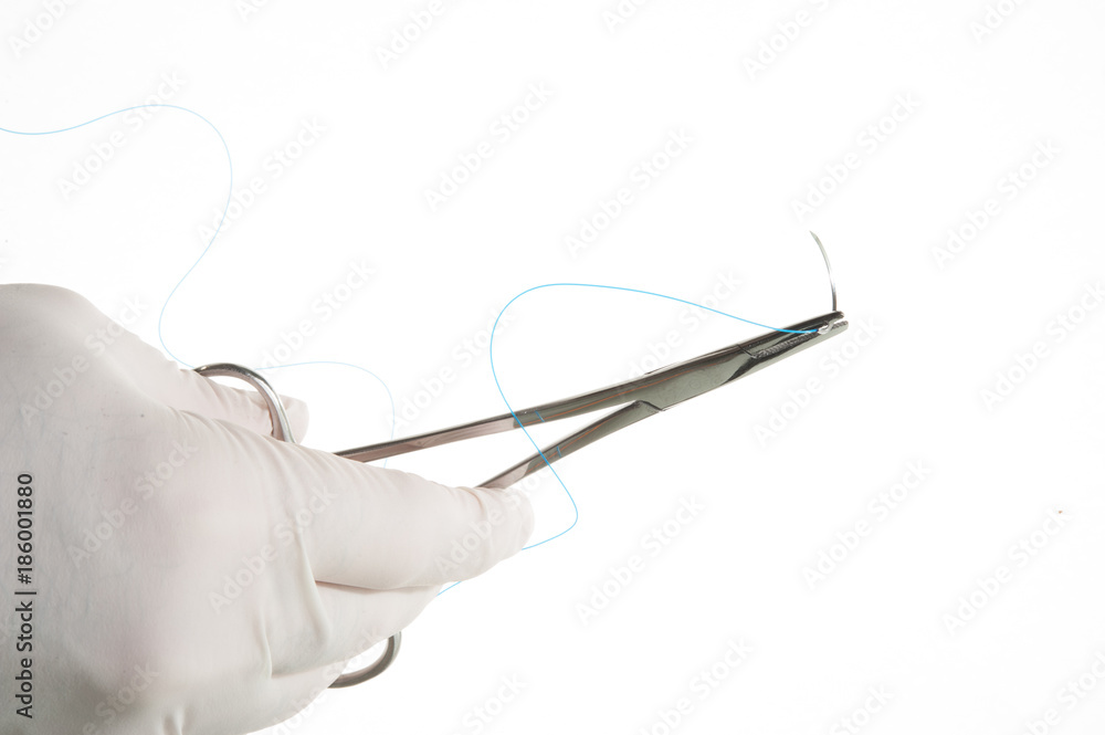 NEEDLE HOLDER AND SUTURE Stock Photo | Adobe Stock