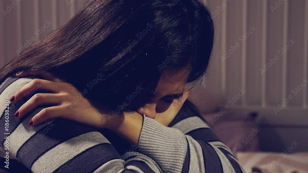 Hispanic female teenager in bedroom crying sad closeup vídeo de Stock ...