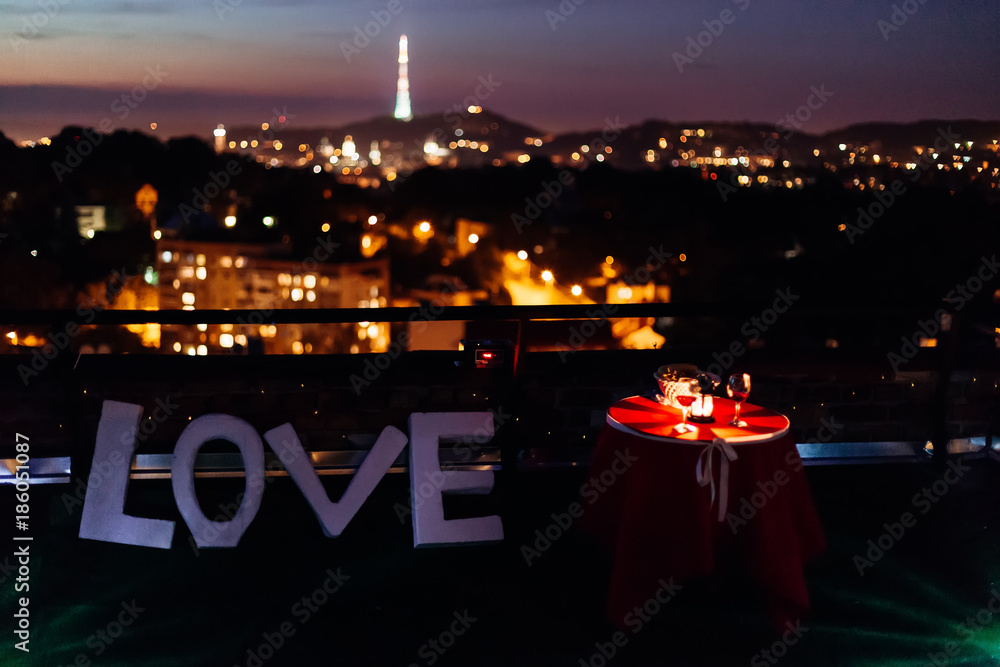 romantic dinner and an inscription for a couple in love on the roof of ...