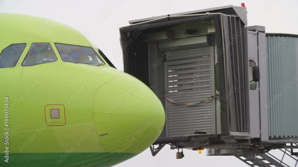Telescopic gangway adheres to the plane Stock Video | Adobe Stock