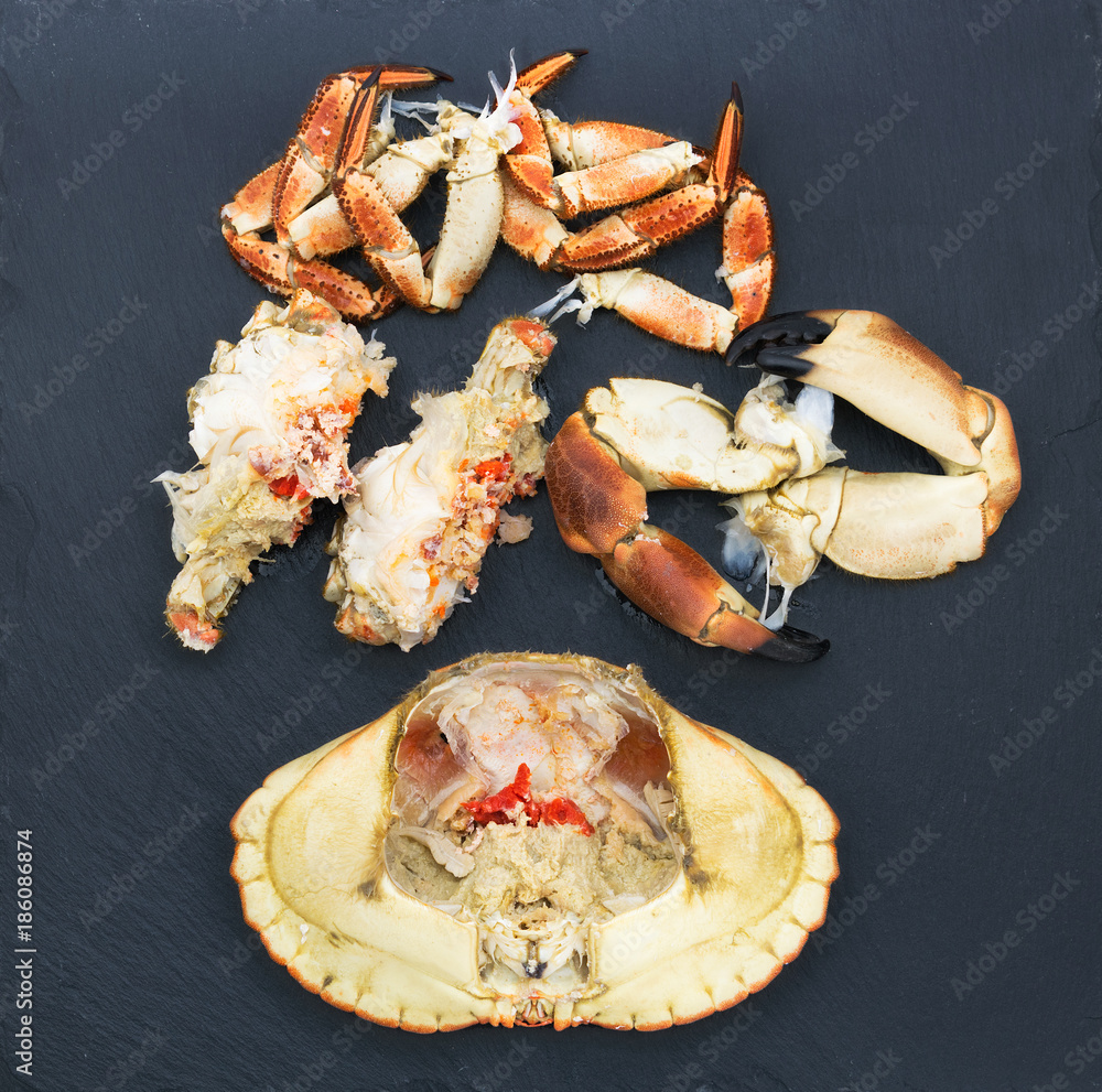 Brown crab ready to eat. We open the shell, pull out the legs and claws ...