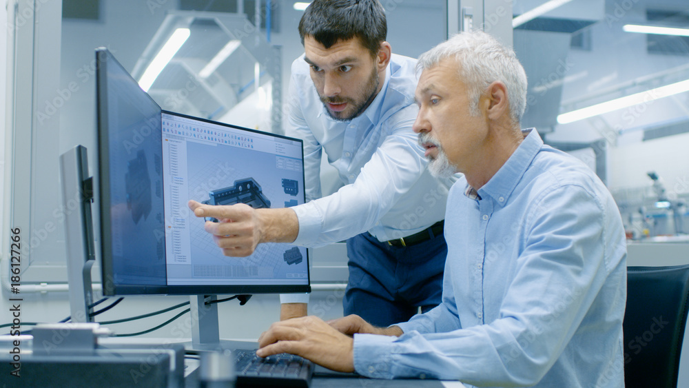 Poster Seior Industrial Engineer Working on a Personal Computer with ...