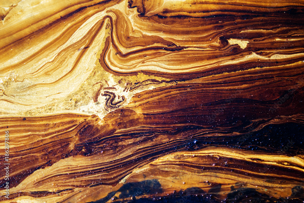 Texture of crude oil spill, pools of crude oil floating on the surface ...