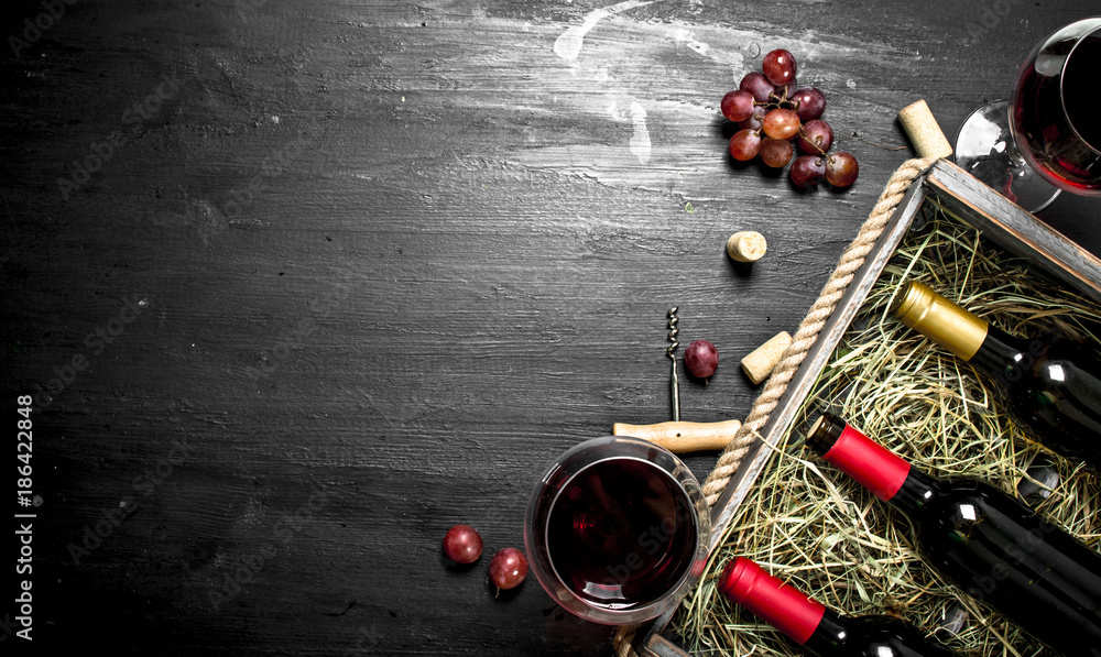 Wine background. Red wine in an old box with a corkscrew. Stock-Foto ...