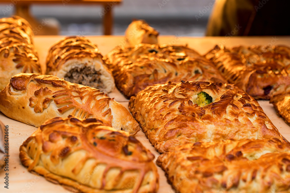 Russian pirozhki or stuffed puff pastry Stock Photo | Adobe Stock