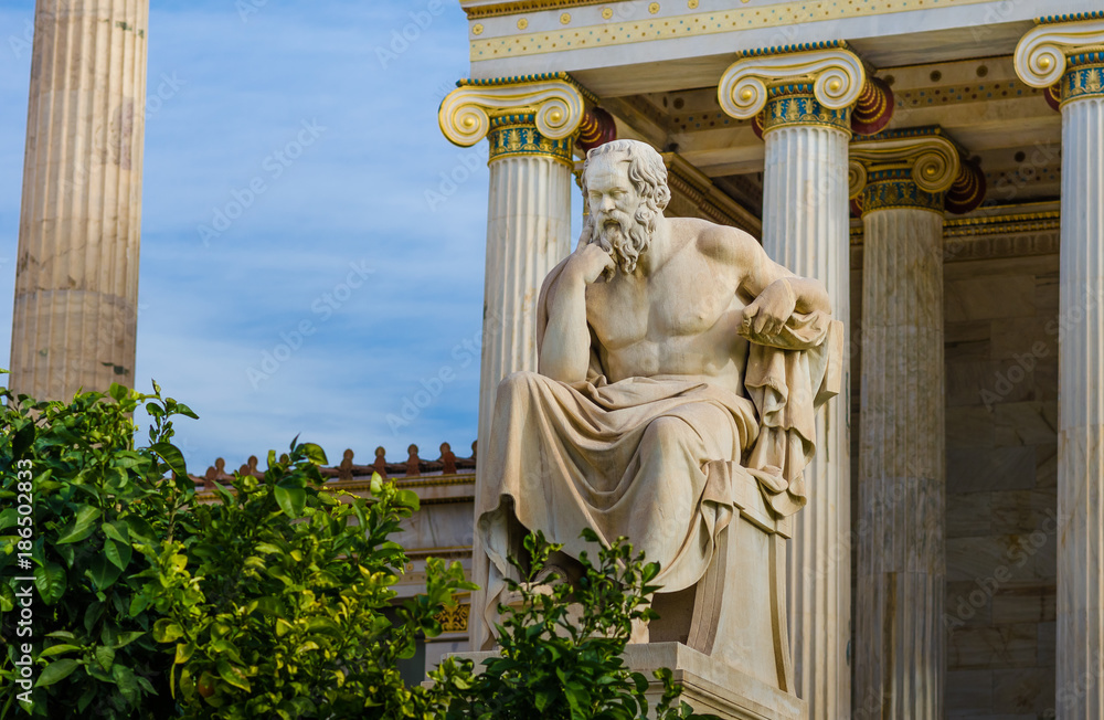 Statue of the greatest Greek philosopher Socrates sitting on a marble ...