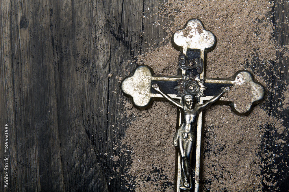 Cross and ash - symbols of Ash Wednesday. Stock Photo | Adobe Stock