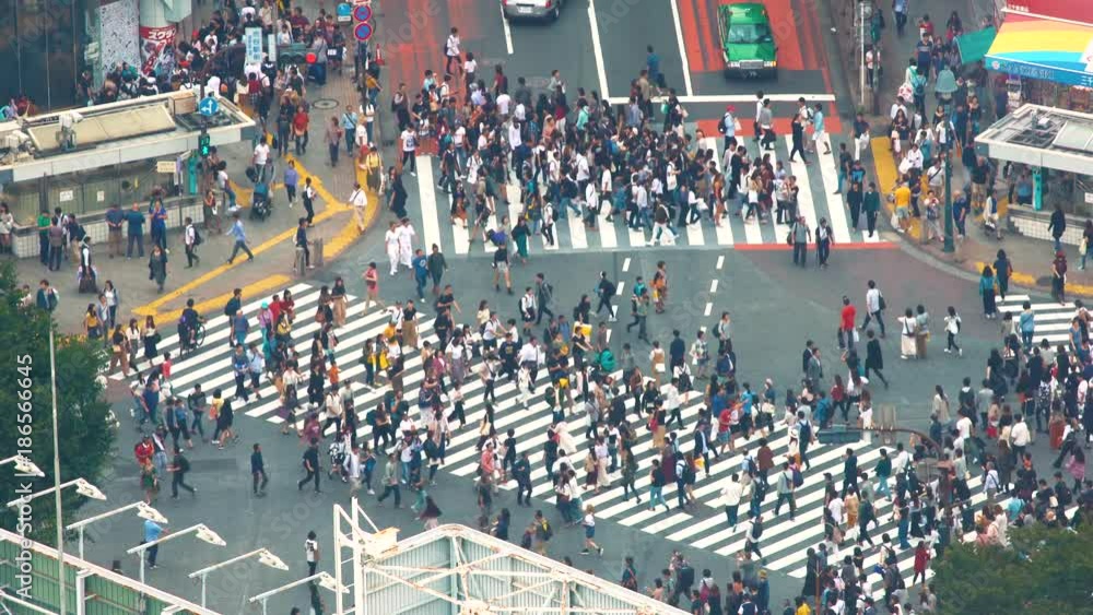 TOKYO, JAPAN - SEP, 25 2017: People cross the famous intersection in ...