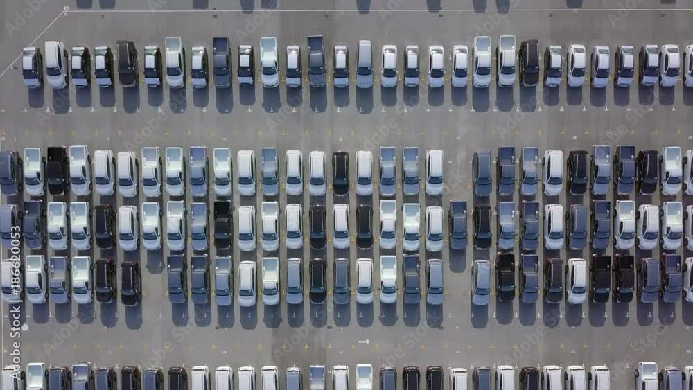 Aerial top down bird view of new car storage parking lot showing ...