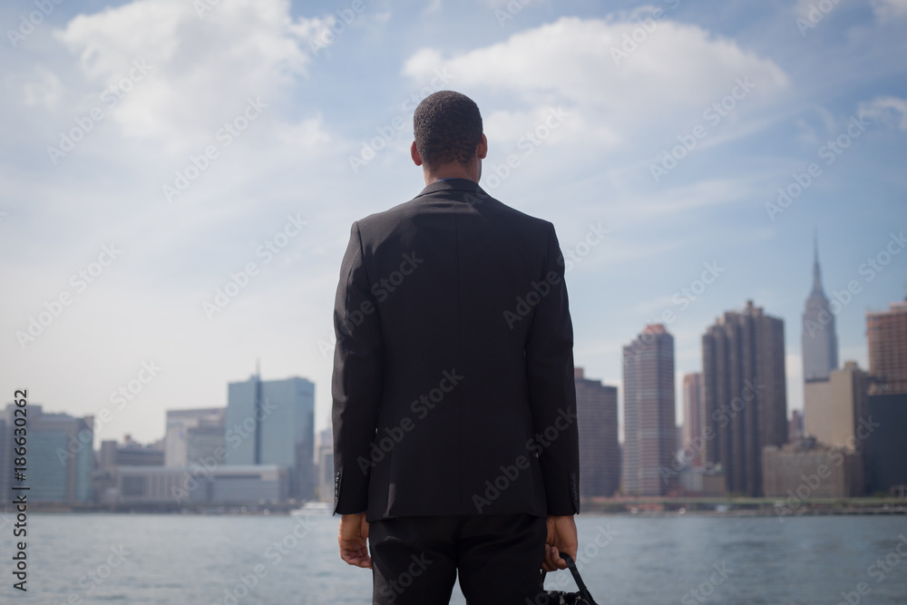 Back view of African American male professional in suits standing ...
