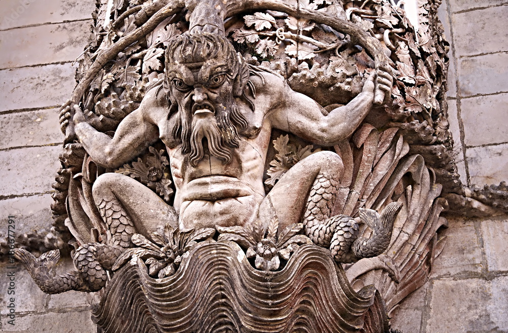 Detail of a statue, the depiction of a mythological triton, symbolizing ...