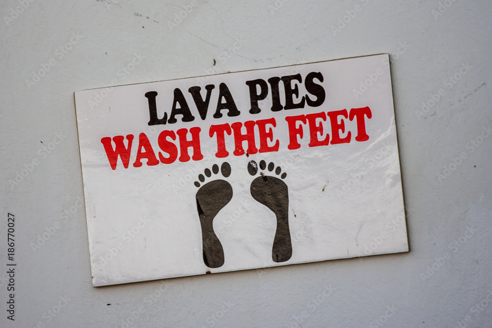 Sign saying "wash the feet" in a swimming pool, Huacachina, Ica, Peru ...