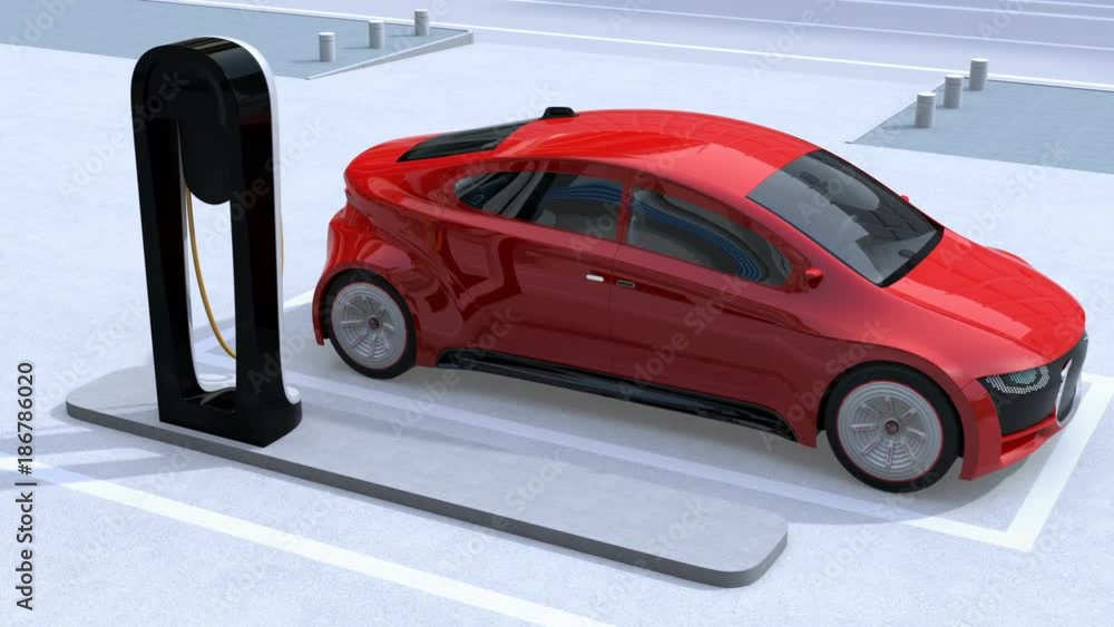 Red electric car driving to charging station and charging electric ...