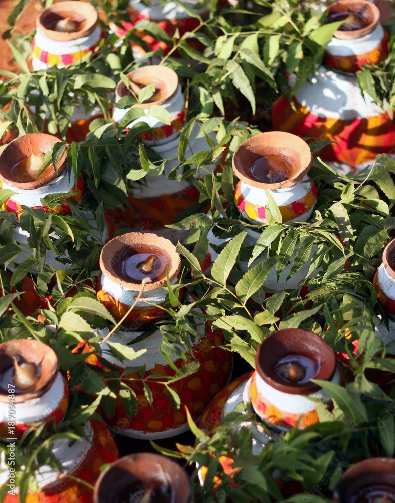 View of earthen pots,decorated with neem leaves,paint,oil and wicks,to ...