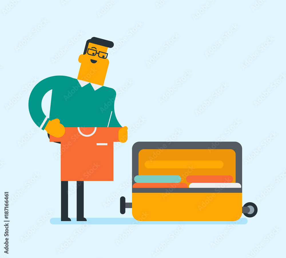 Young caucasian white man packing his clothes in an opened suitcase ...