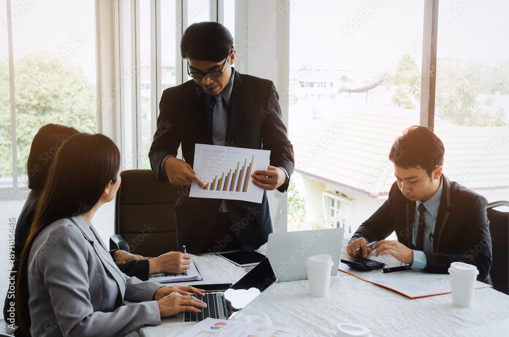 asian project manager showing and presenting growth chart diagram of ...
