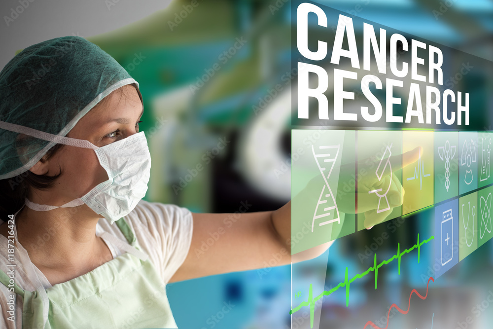 Cancer research concept. Doctor using a futuristic touch screen concept ...